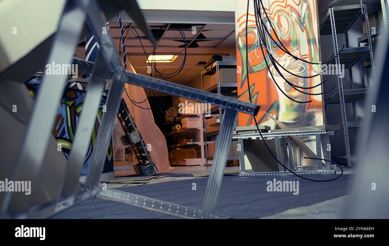 Empty basement with damaged objects and graffiti paint, concept of ...