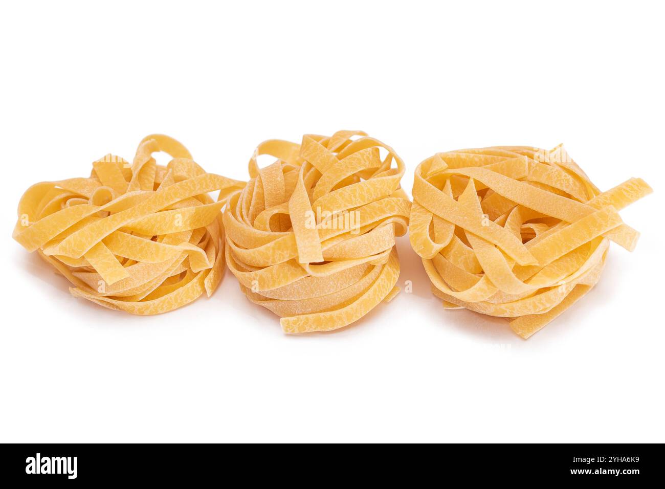 Three Classic Italian Raw Egg Fettuccine - Isolated on White Background ...
