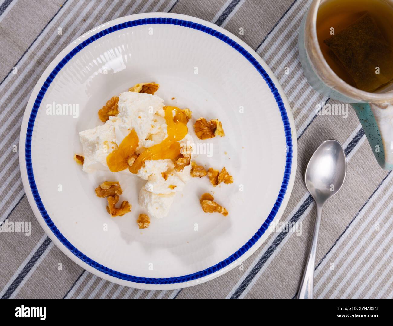 Cottage cheese with walnuts and honey Stock Photo - Alamy