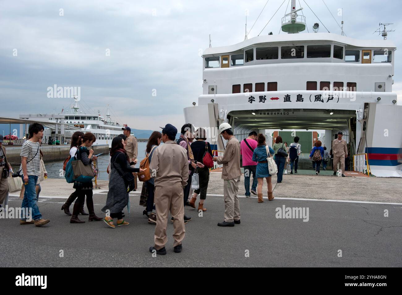 Passengers boarding ferry boat departing Naoshima art island for the ...