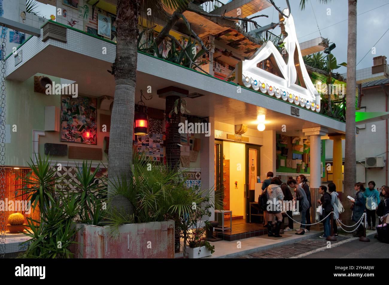 People standing in line to enter the "I Love Yu" (I Love Hot Water ...