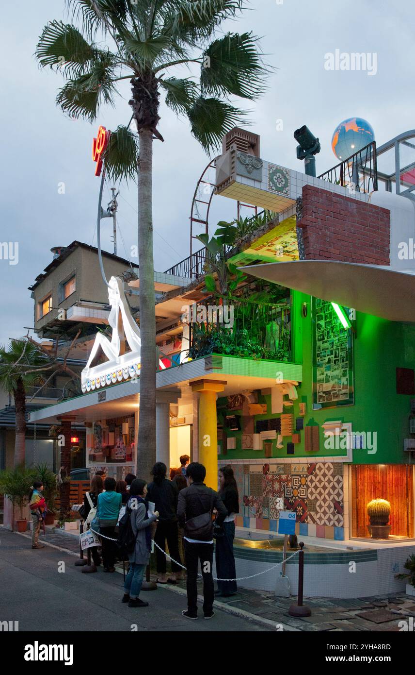 People standing in line to enter the "I Love Yu" (I Love Hot Water ...