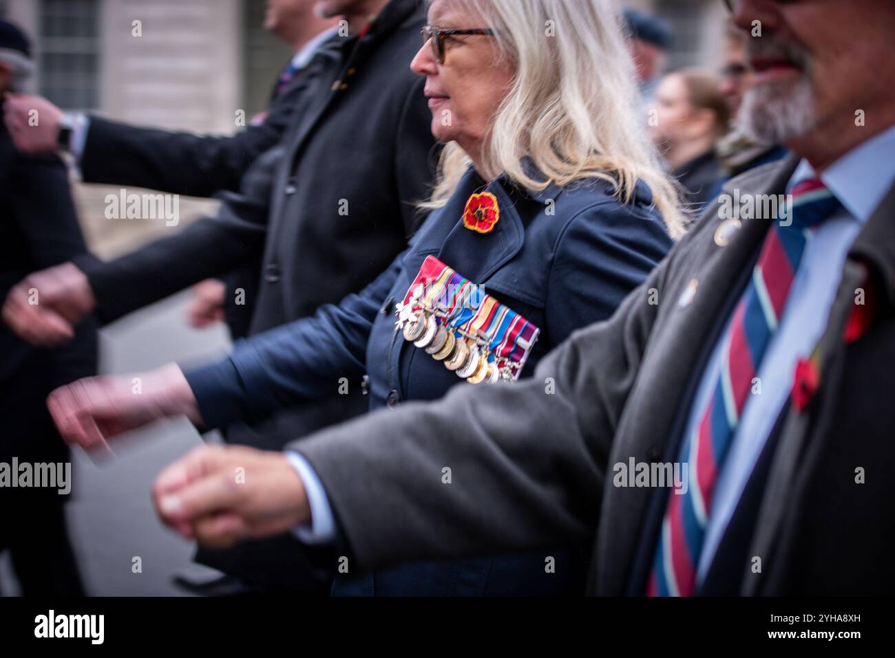 The military and civilian servicemen and women march during the Remembrance Day Cenotaph Parade ...