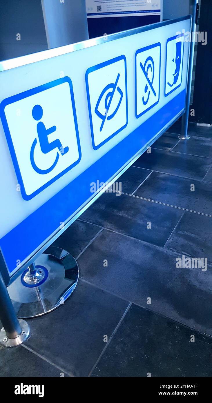 Blue panel with priority signage for people with disabilities, blind ...