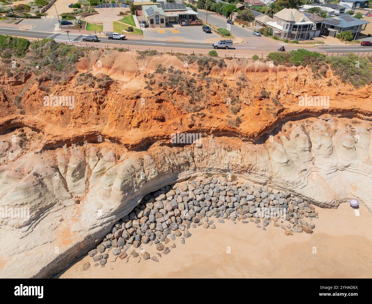Aerial view of eroded cliffs below a coastal esplanade at Port ...