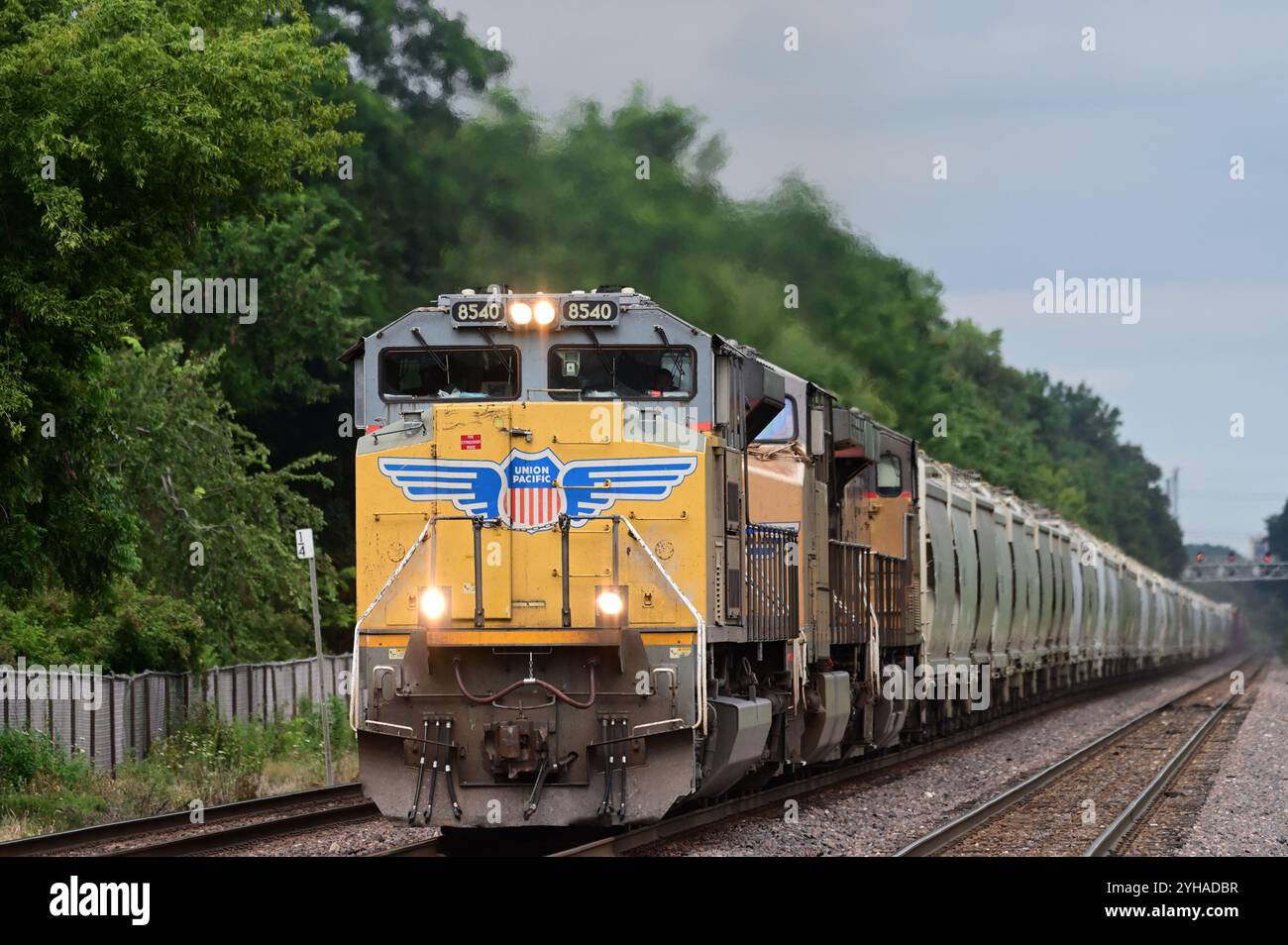 Glen Ellyn, Illinois, USA. A Union Pacific Railroad grain train led by ...