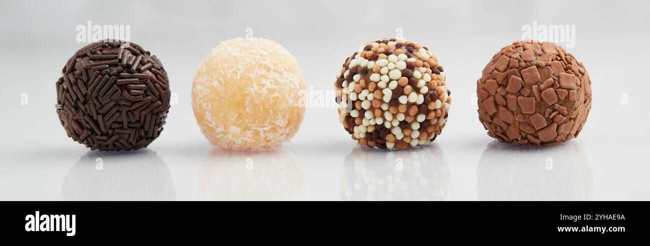 Typical Brazilian sweet brigadeiro. Line of candies with different ...