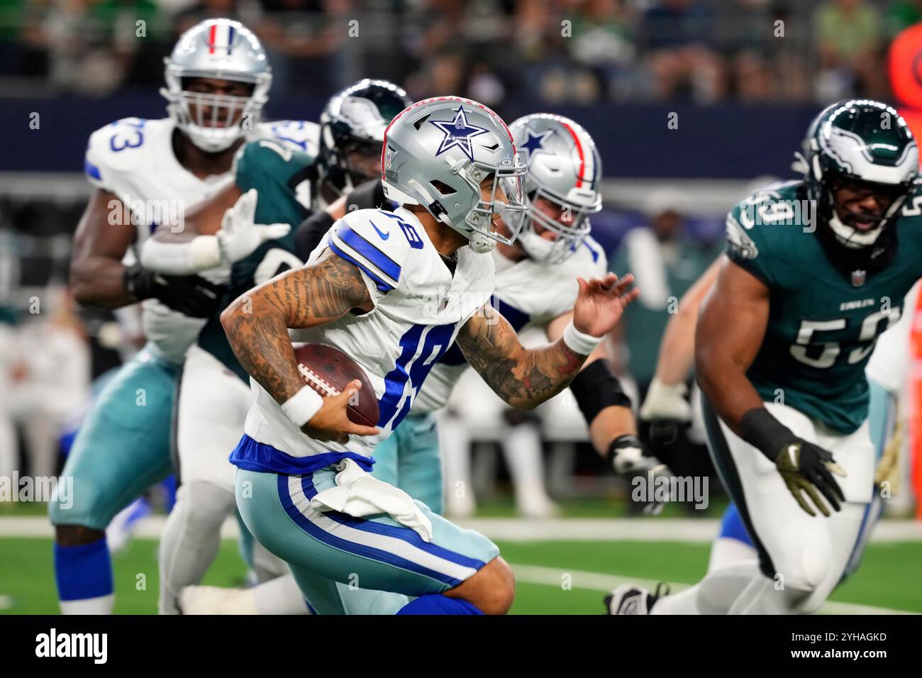 Dallas Cowboys quarterback Trey Lance runs the ball under pressure from ...
