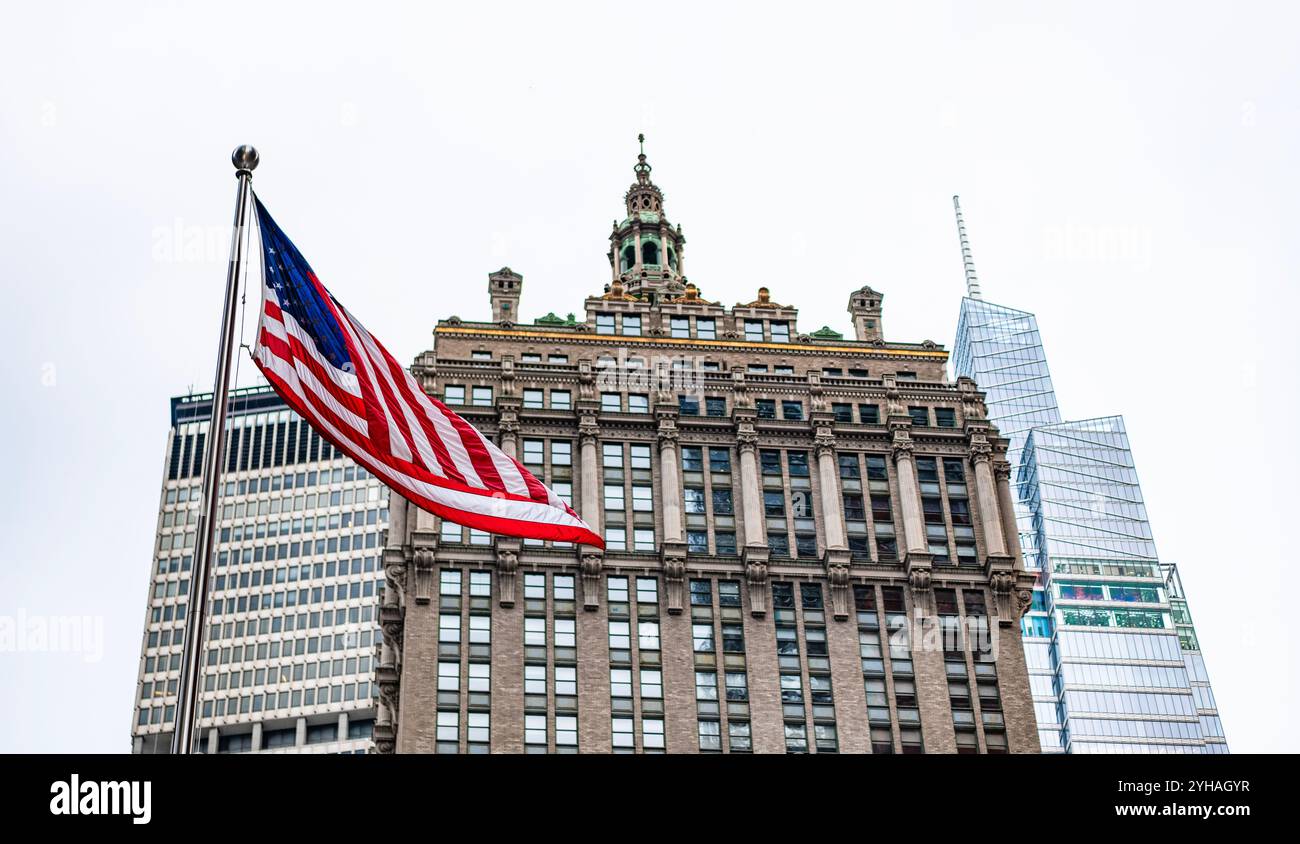 American flag at modern building in metropolis city. Business building ...