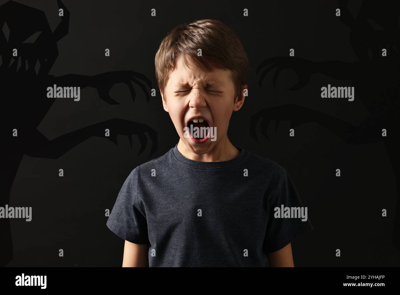 Scared by monsters, boy screaming, teraphobia. Creepy shadows behind ...