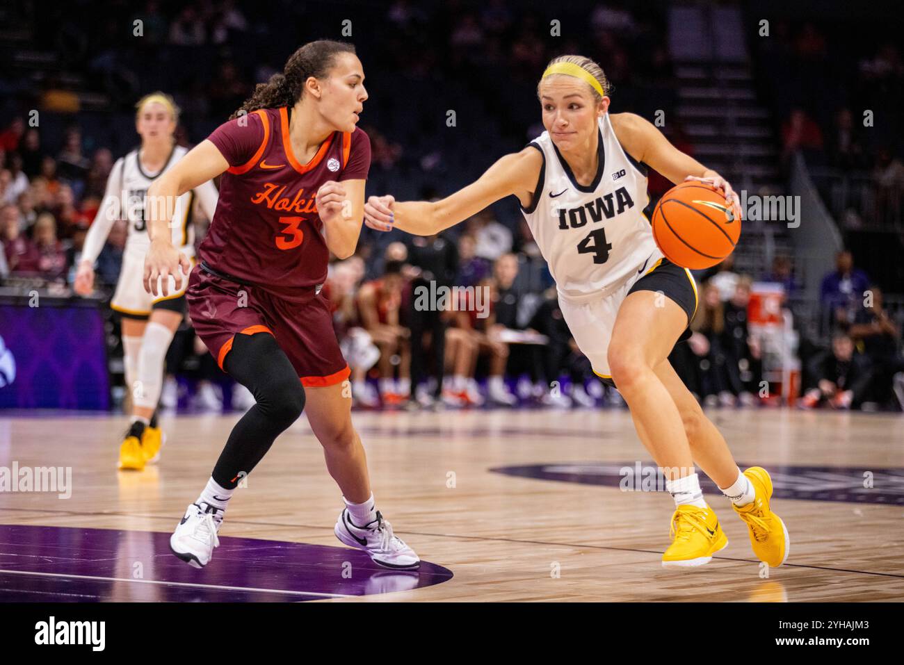 Charlotte, NC, USA. 10th Nov, 2024. Iowa Hawkeyes guard Kylie Feuerbach (4) drives on Virginia ...