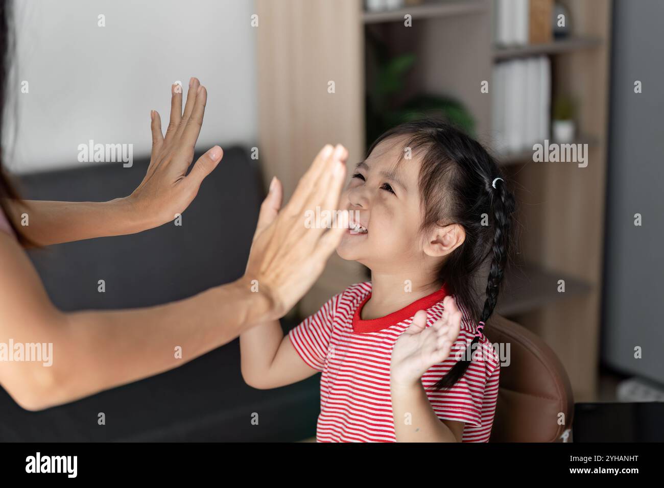 Joyful Child Engaging in Interactive Learning Activity with Teacher in ...