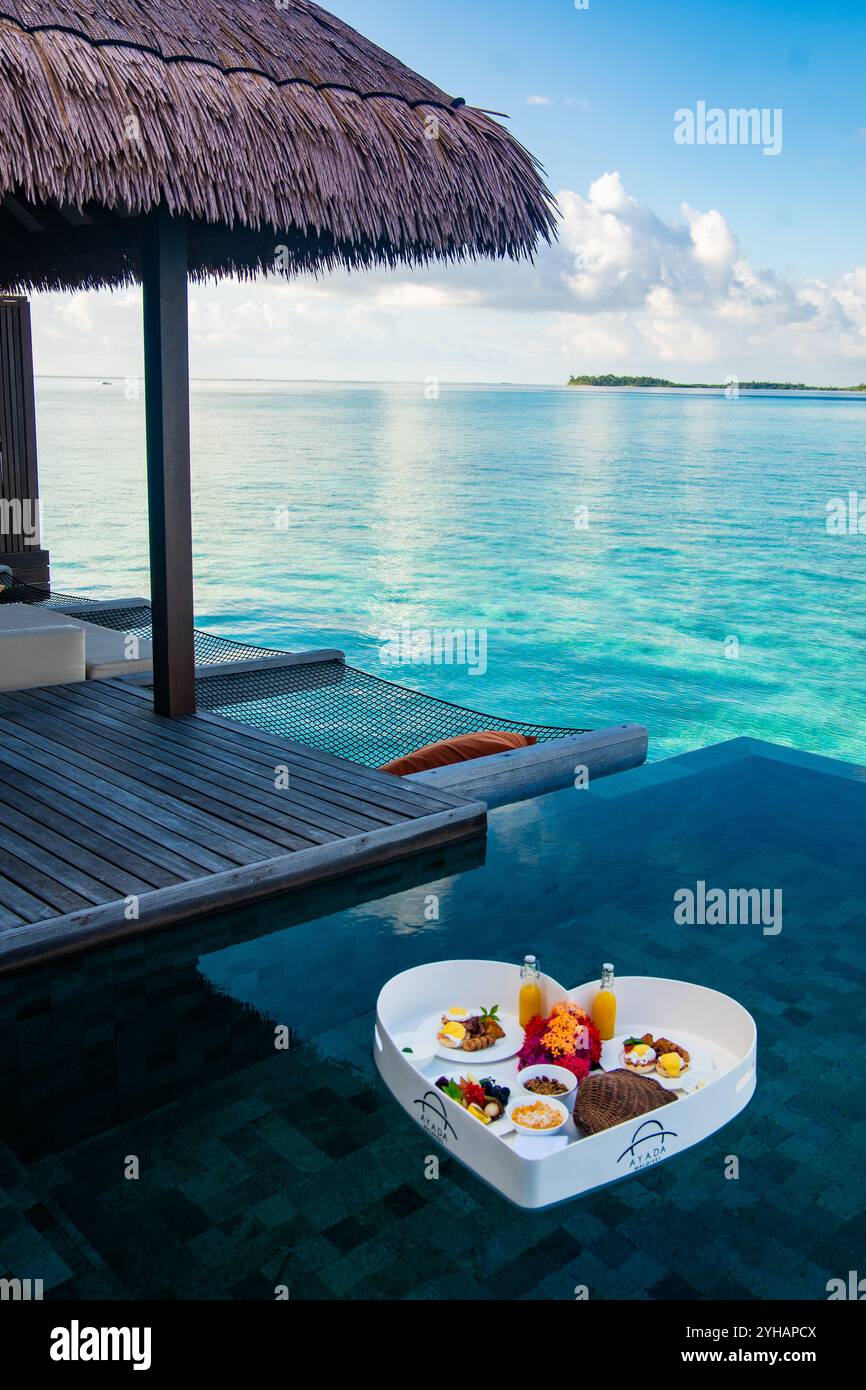 Floating breakfast in a heart shape in the pool in Maldives Stock Photo ...