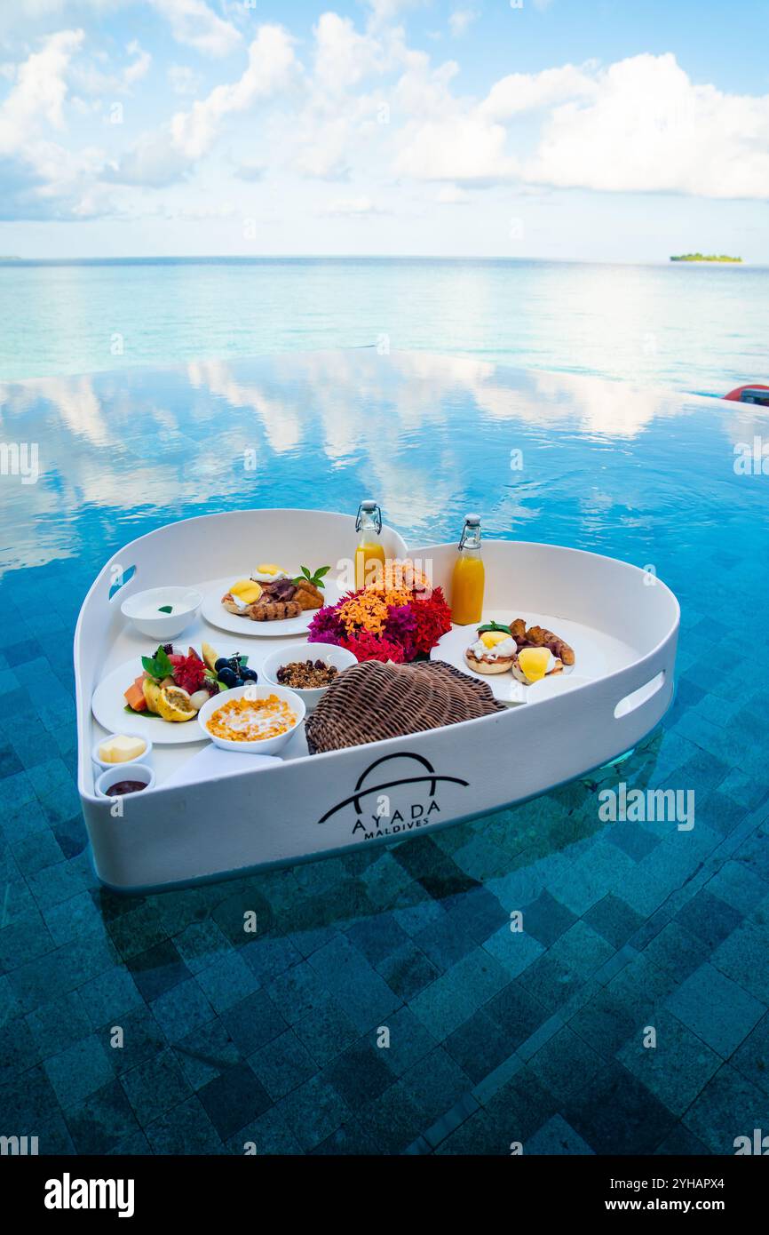 Floating breakfast in a heart shape in the pool in Maldives Stock Photo ...
