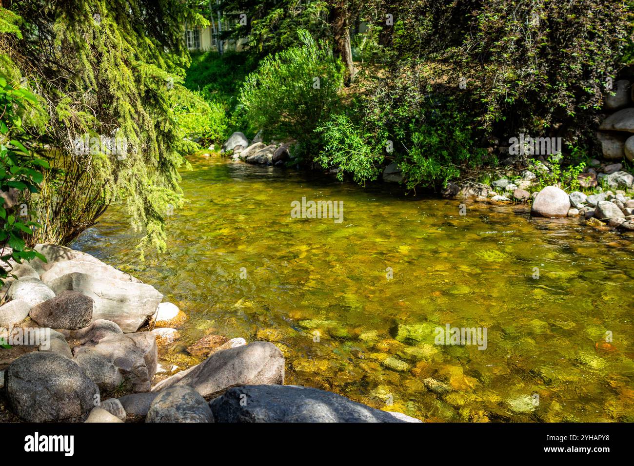 Vail, Colorado ski resort town with Gore creek river transparent water ...