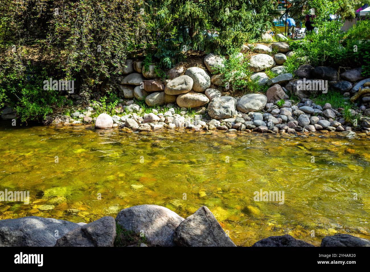Vail, Colorado ski resort town with Gore creek river by lodge buildings ...
