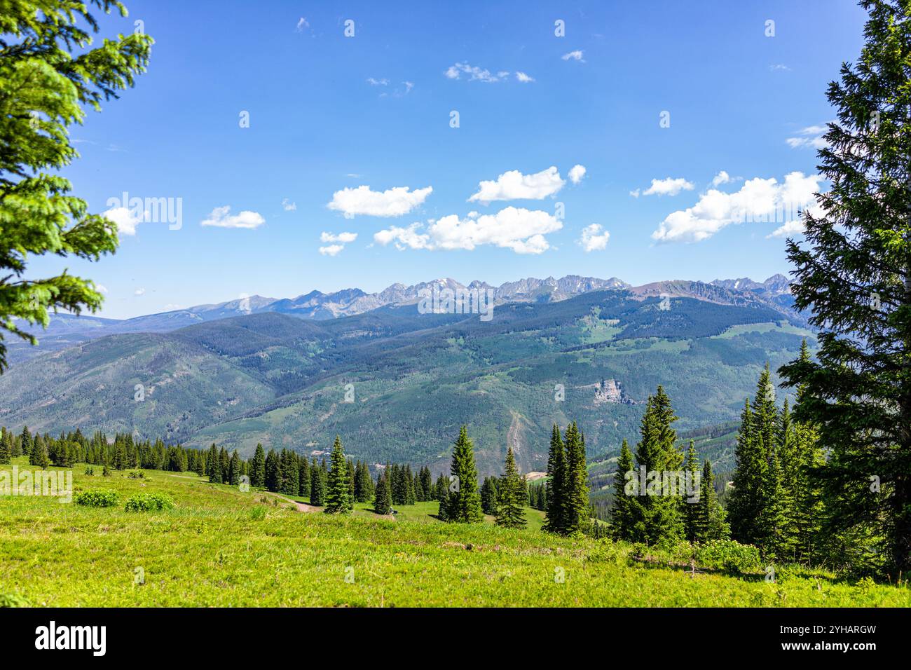 Vail summer in ski resort with hiking trail in Colorado, mountain peaks ...