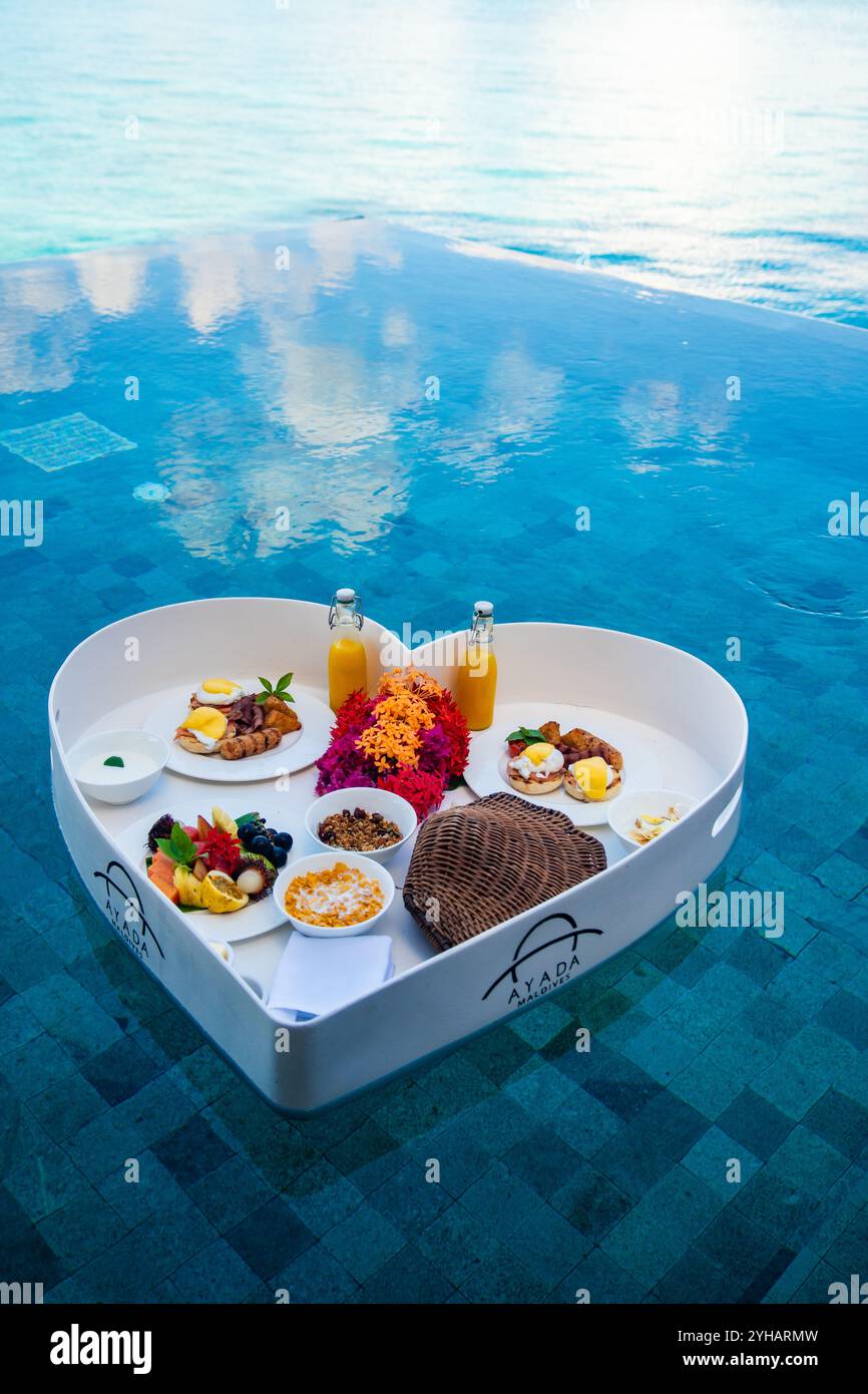 Floating breakfast in a heart shape in the pool in Maldives Stock Photo ...