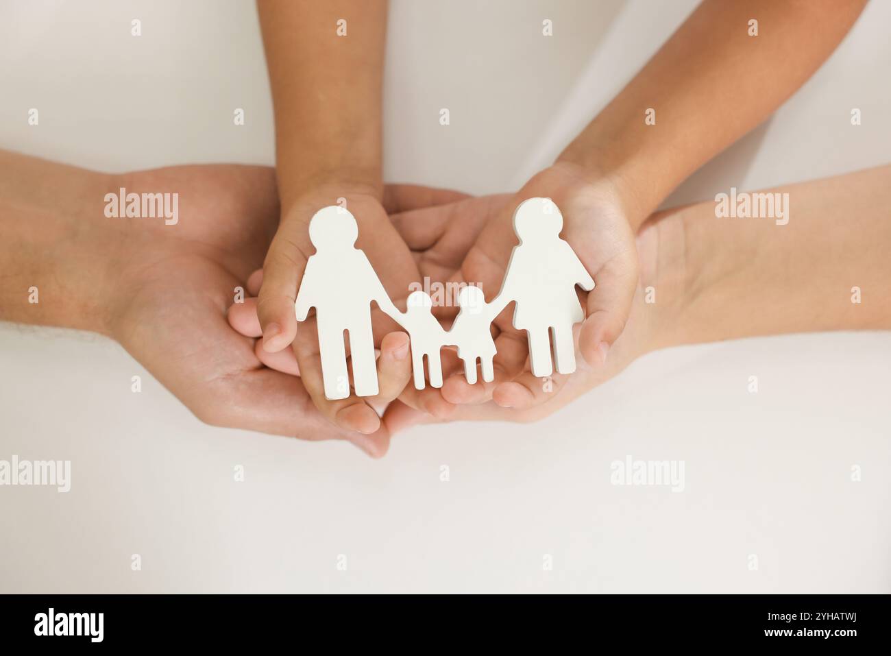 Parents and child with figures of family on white background, top view ...