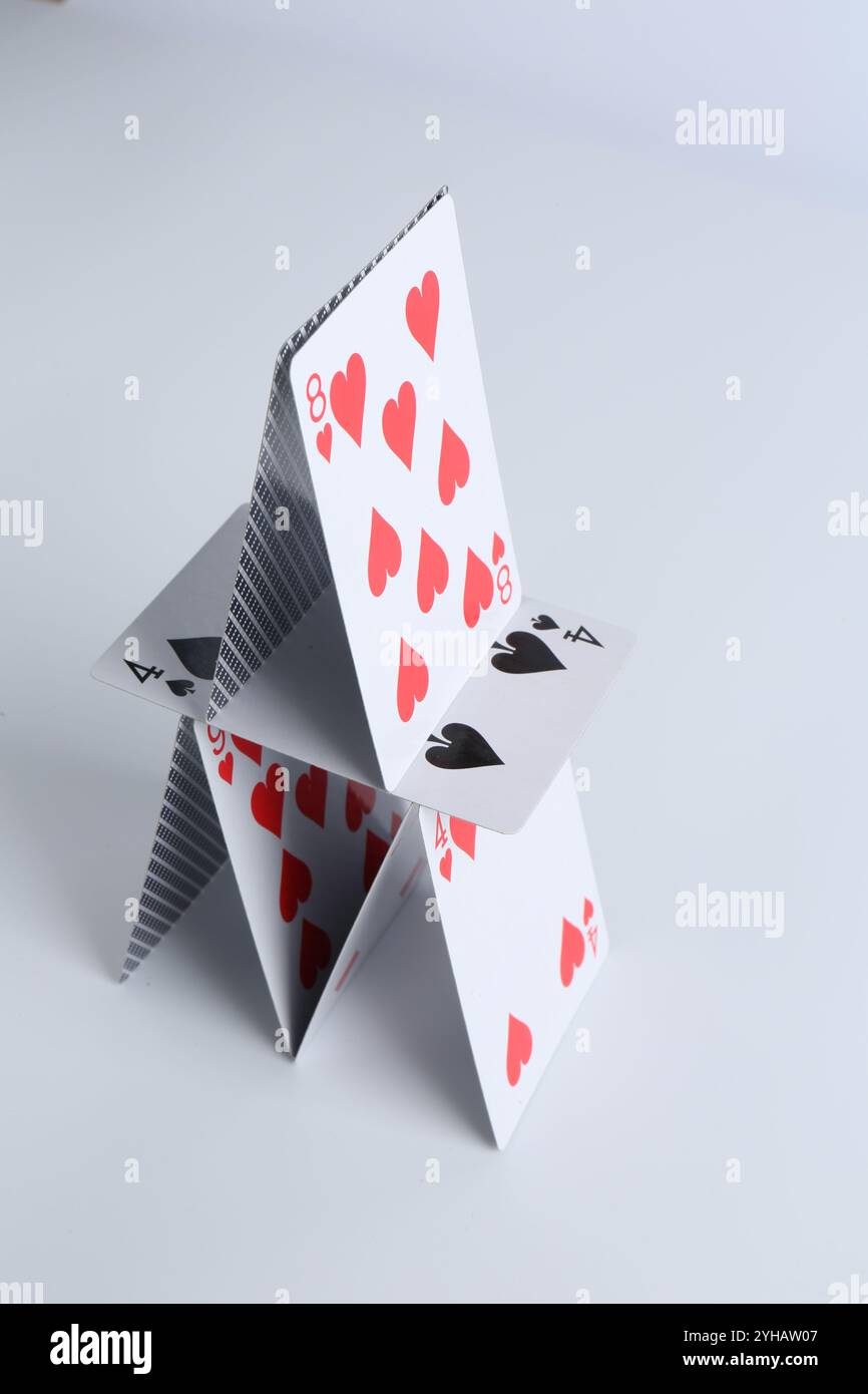 House of playing cards on white background Stock Photo - Alamy
