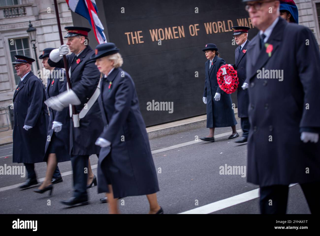 London, UK. 10th Nov, 2024. The military and civilian servicemen and women march past The Women ...