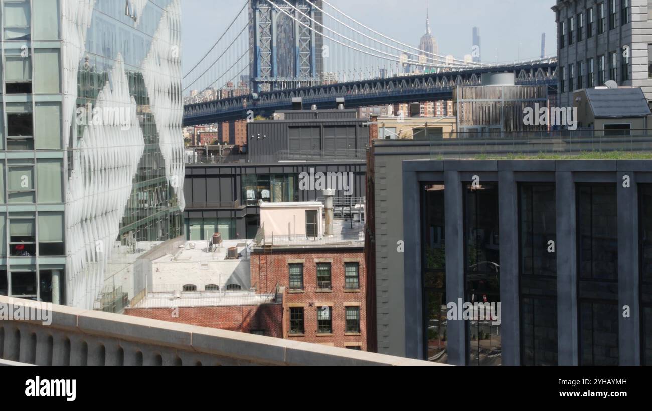 New York City Manhattan Bridge view from Brooklyn Bridge. Empire State ...