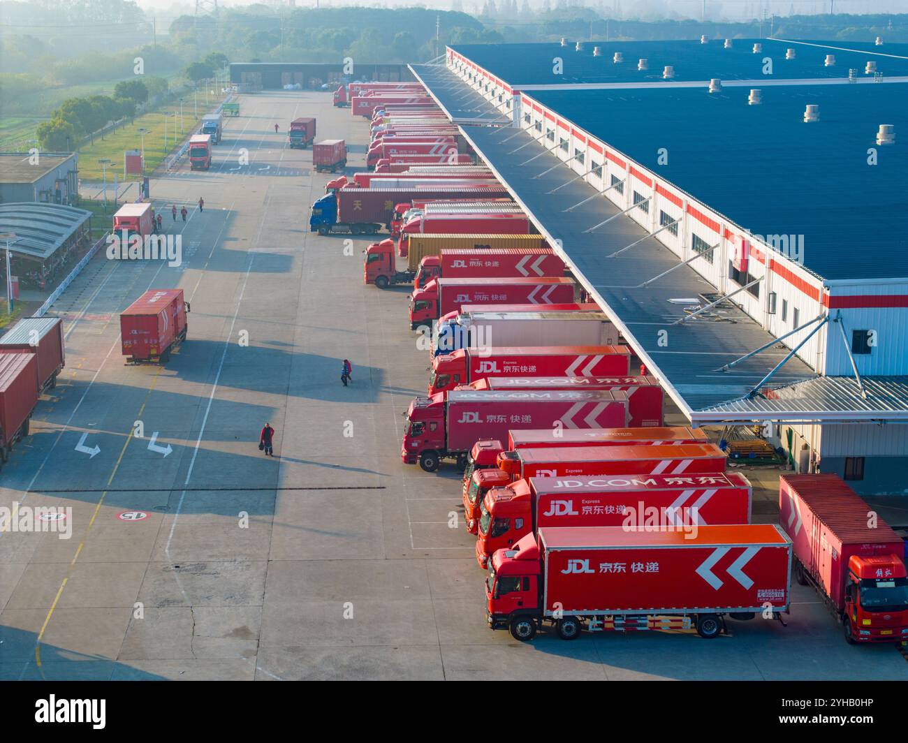 KUNSHAN, CHINA - NOVEMBER 11, 2024 - Multiple express logistics trucks ...