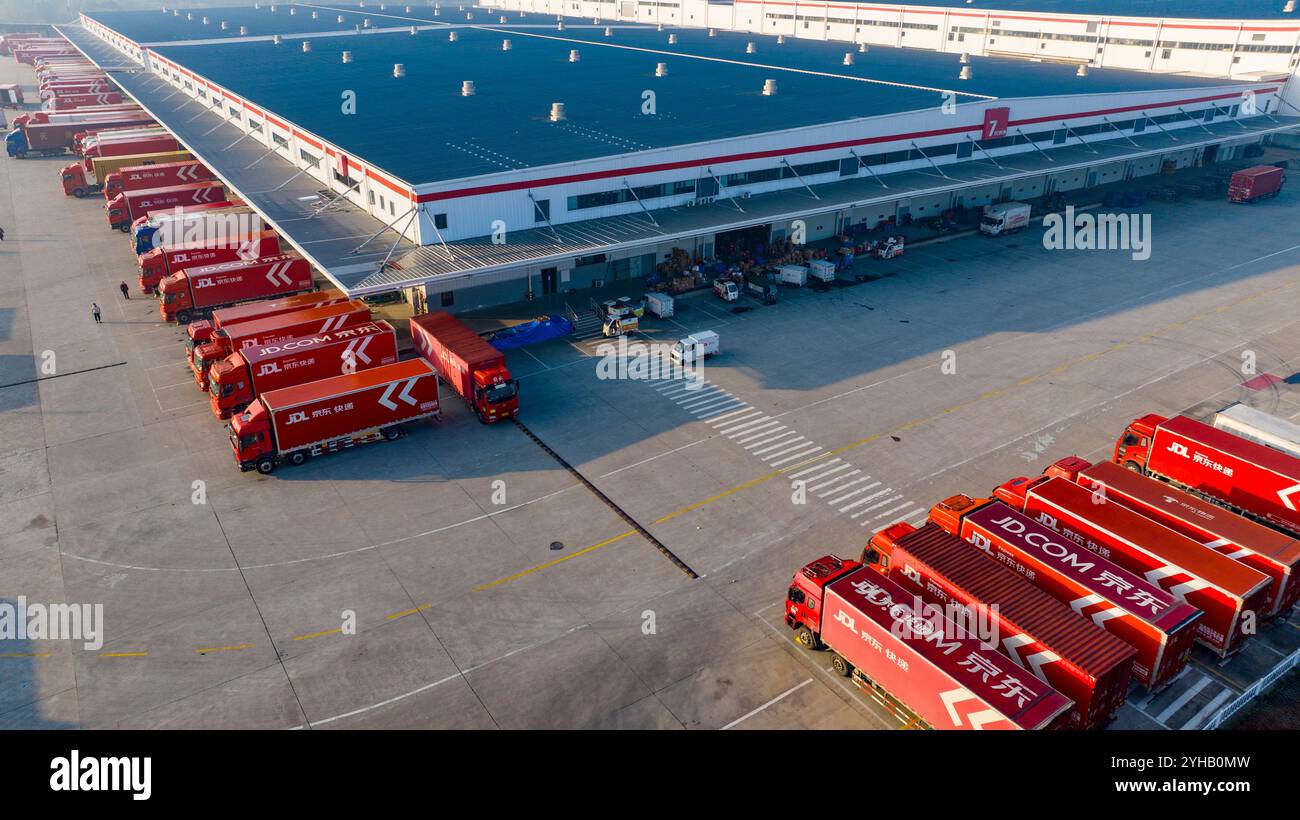 Multiple express logistics trucks load and unload goods at Jingdong ...