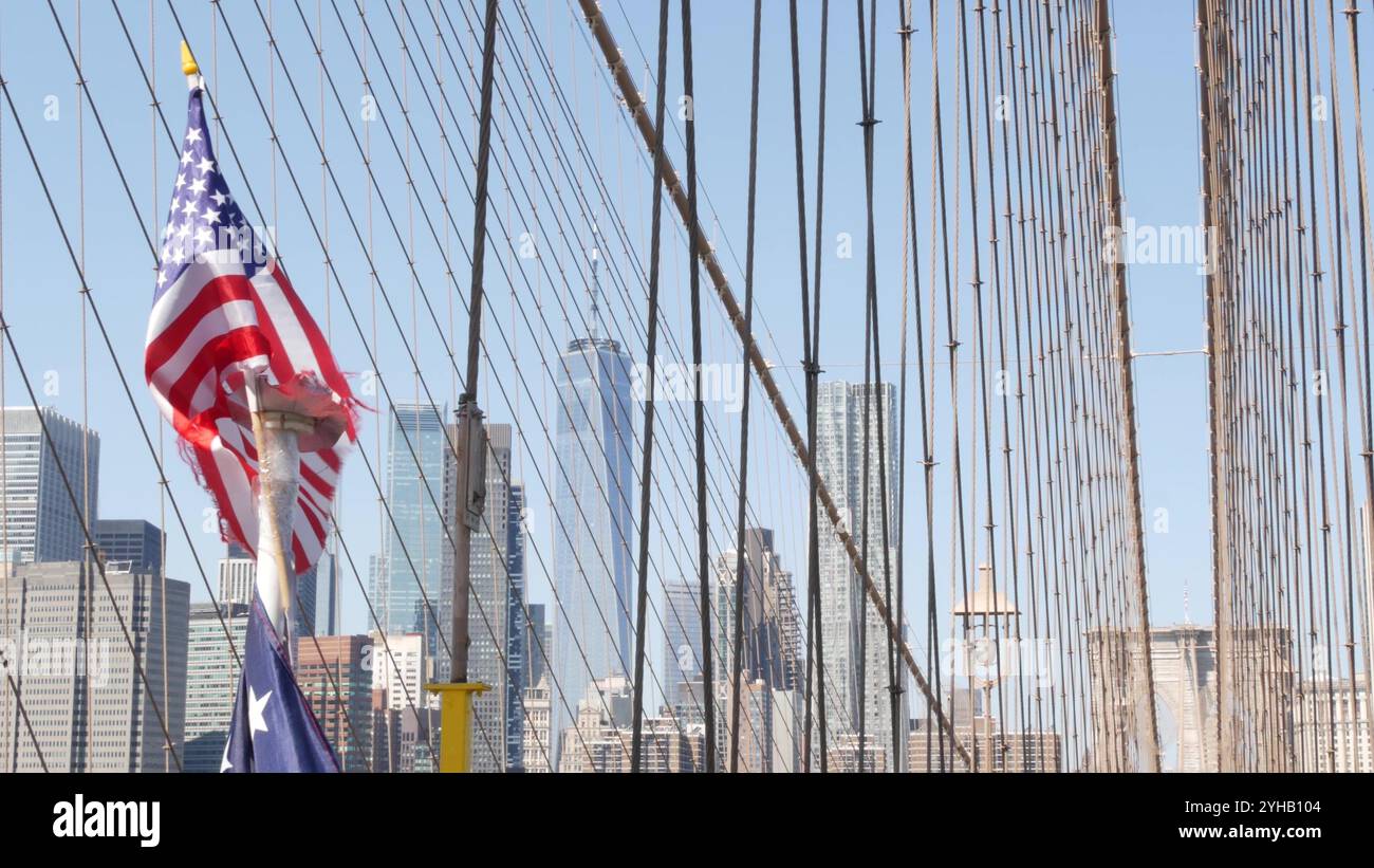 Flag on Brooklyn Bridge, Manhattan downtown, New York City skyline ...