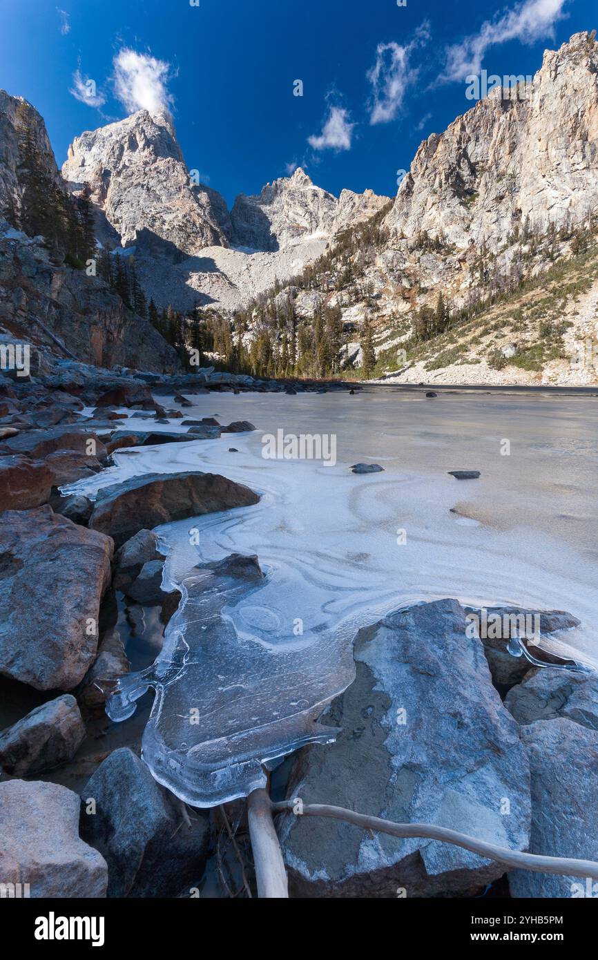 Delta Lake begins to freeze over for the season beneath the Grand Teton ...
