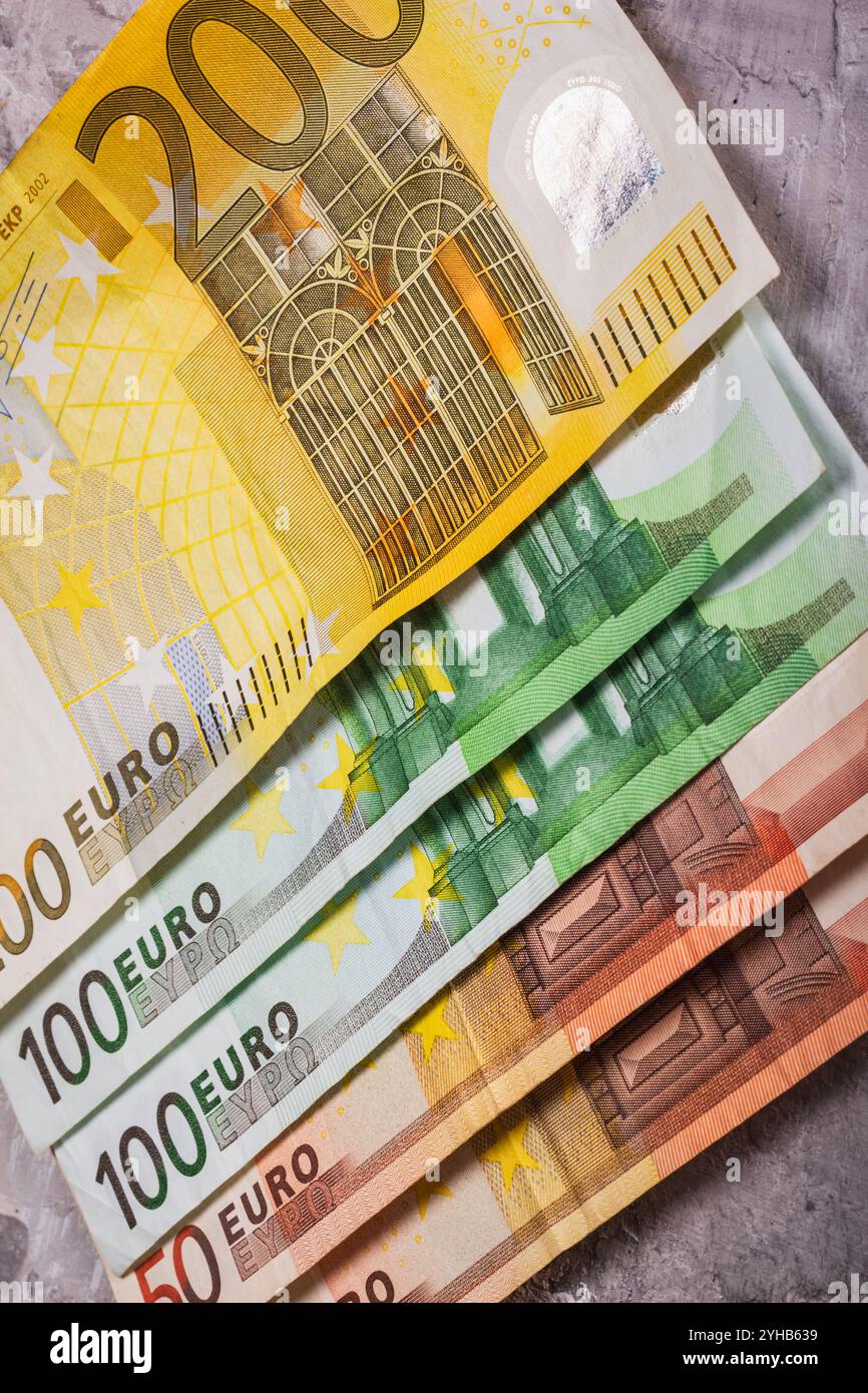 A collection of Euro banknotes in various denominations, showcasing ...