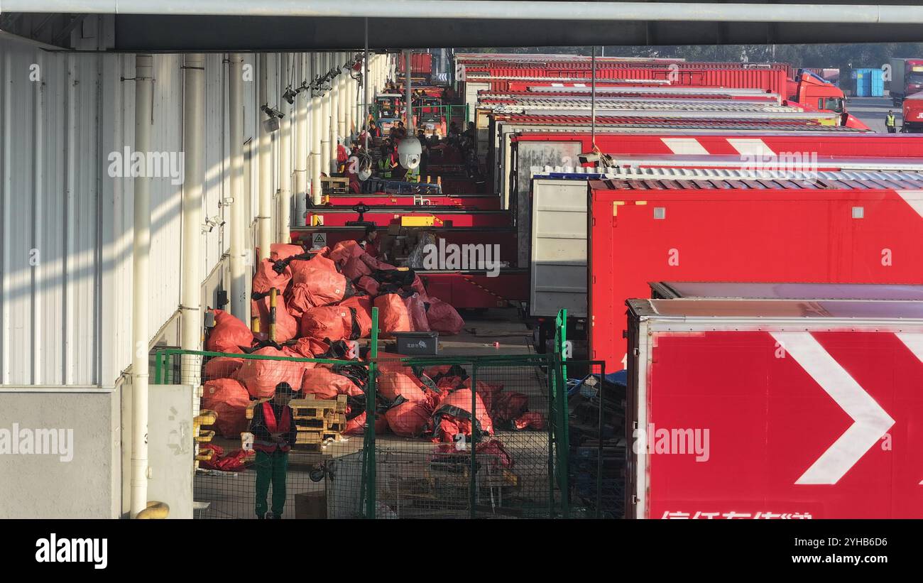 KUNSHAN, CHINA - NOVEMBER 11, 2024 - Multiple express logistics trucks ...