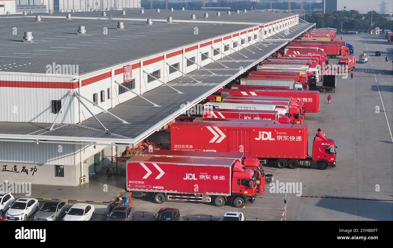 KUNSHAN, CHINA - NOVEMBER 11, 2024 - Multiple express logistics trucks ...