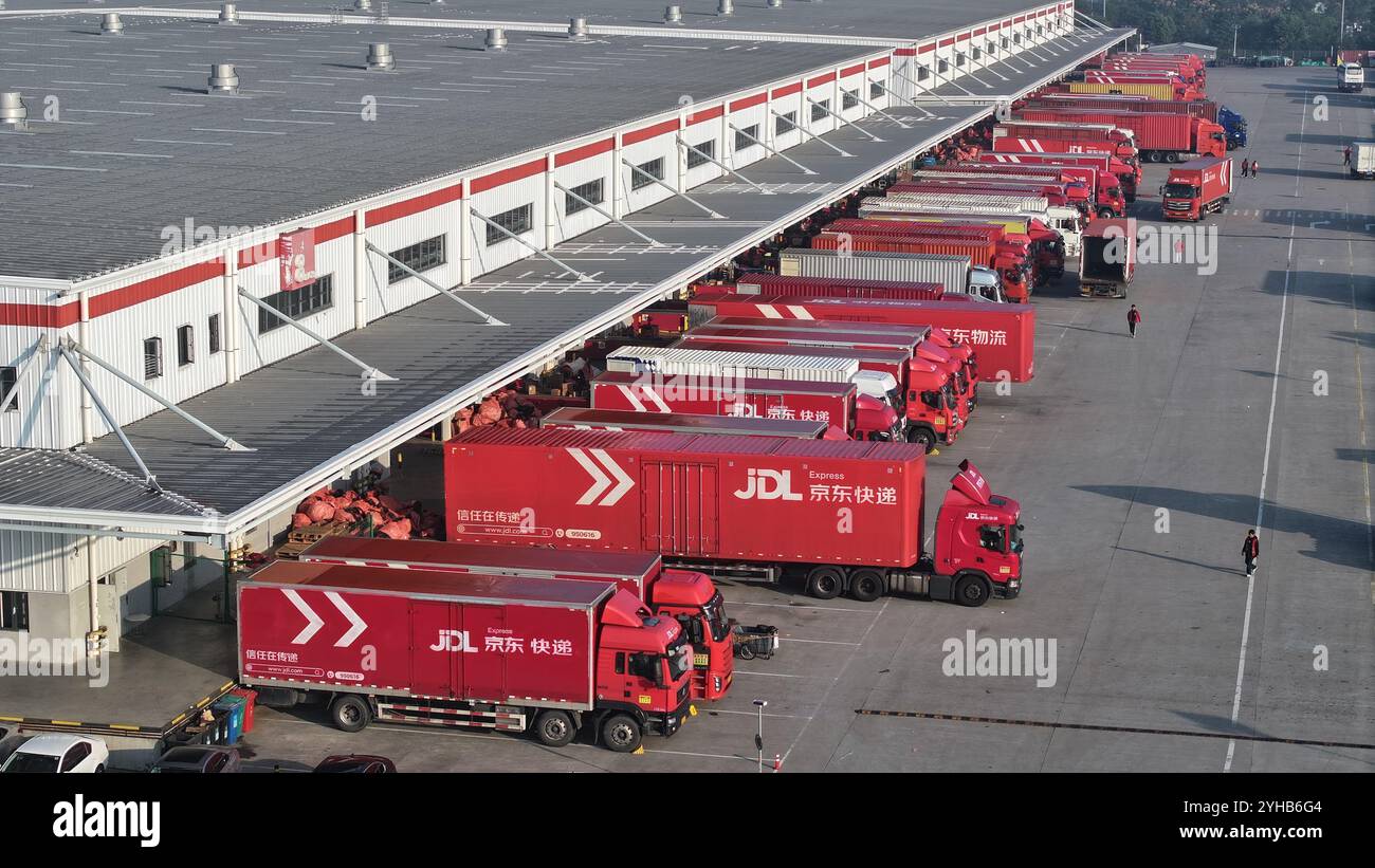 KUNSHAN, CHINA - NOVEMBER 11, 2024 - Multiple express logistics trucks ...