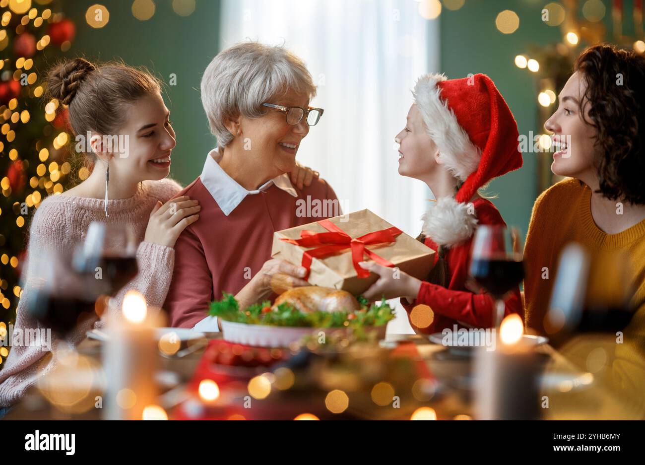 Merry Christmas. Happy family are having dinner at home. Celebration holiday and togetherness ...