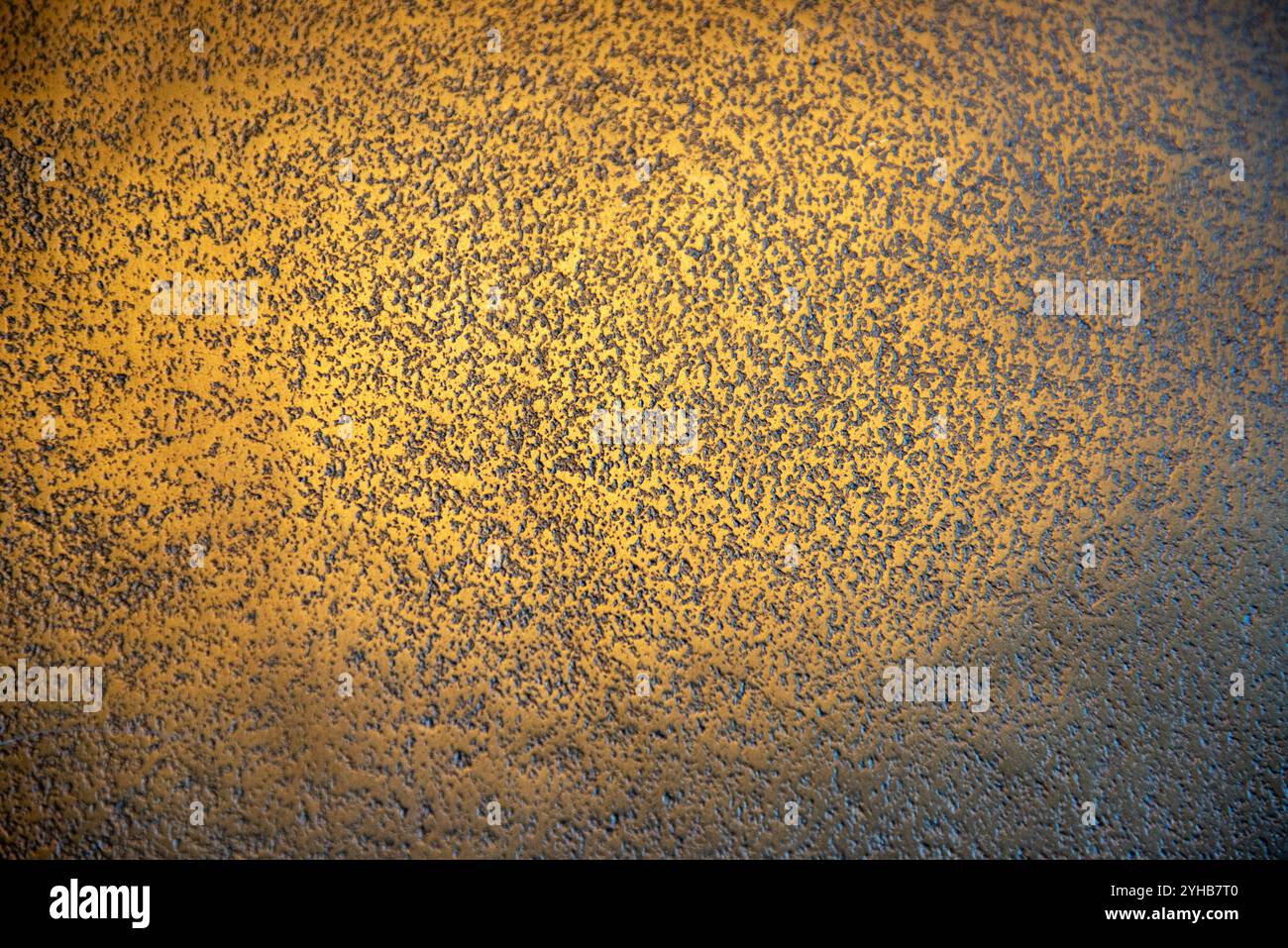 Rustic golden brass colored textured metal material with shawdow and ...