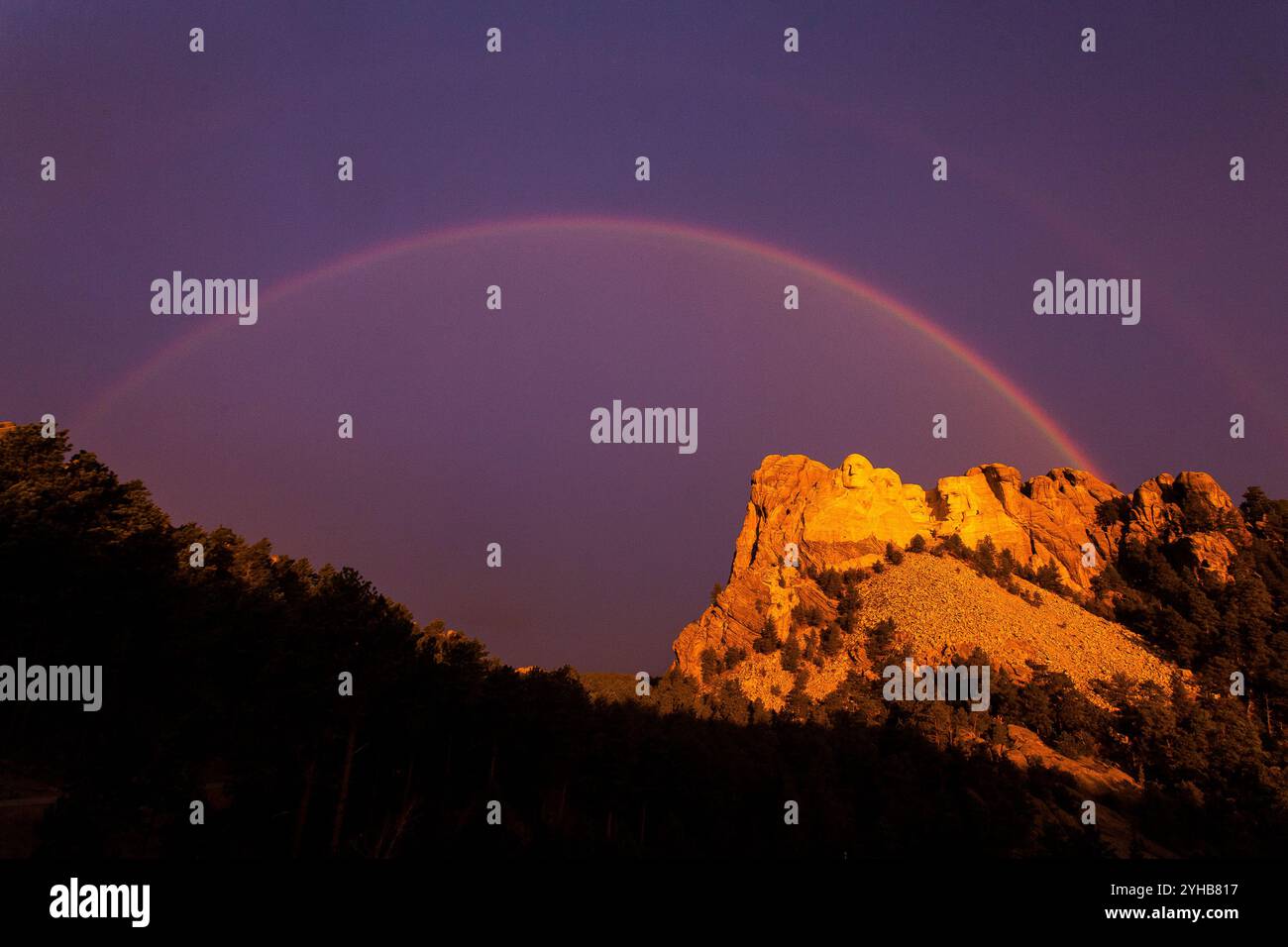 A double rainbow arches over the presidents of Mount Rushmore, South ...