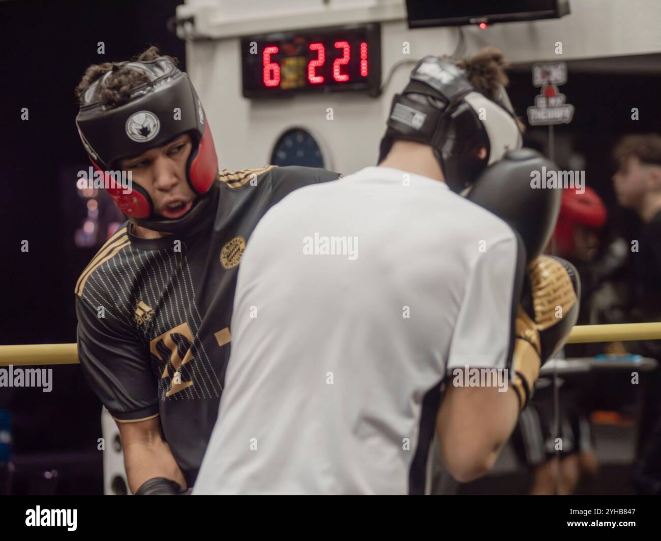 Cremona, Italy - October 29th 2024 Two boxers are in a ring with a ...