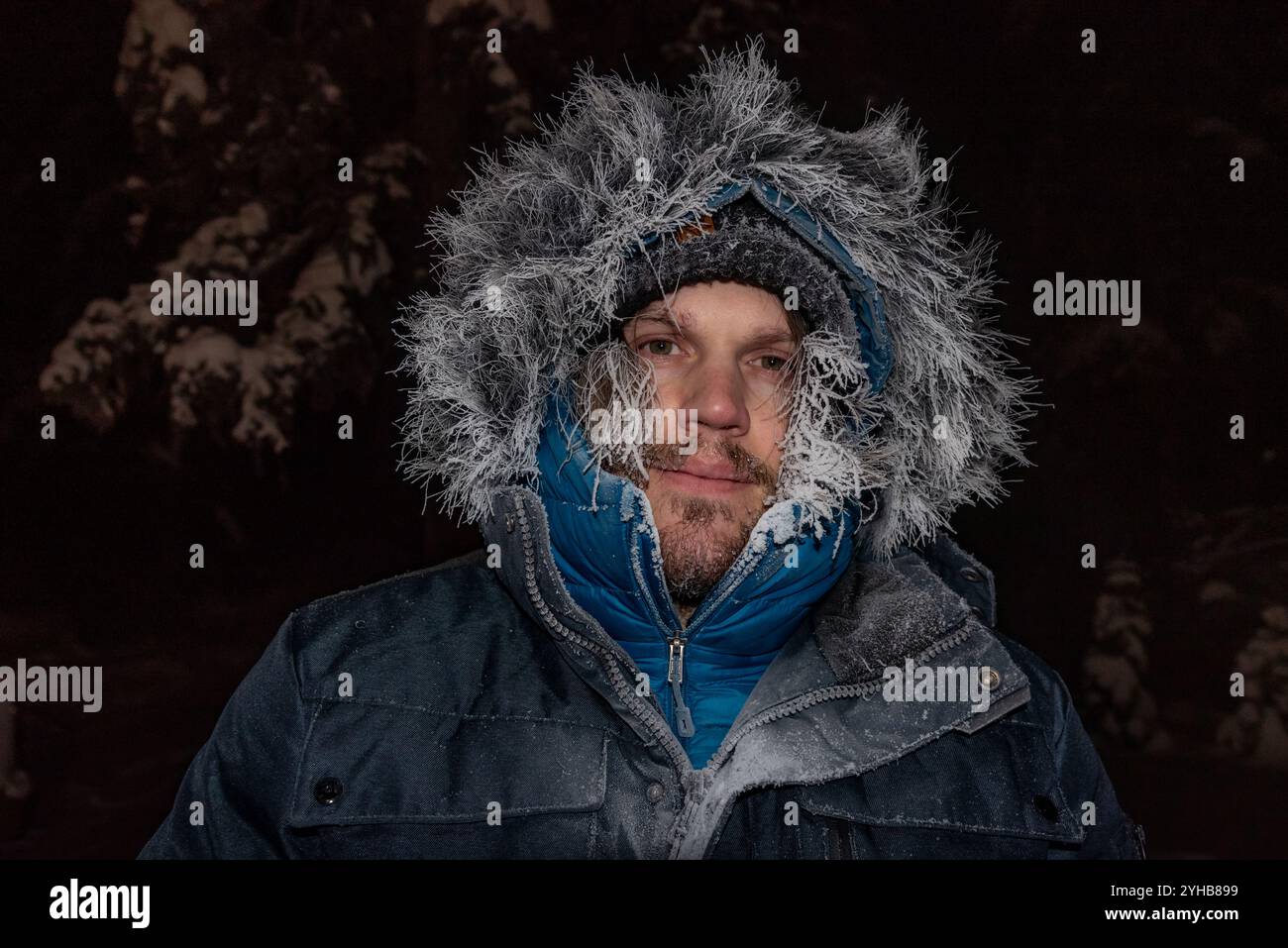 Man with frozen hair tips on a cold winter night in northern Canada ...