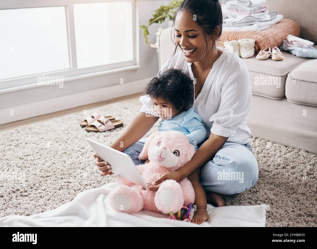 Home, mom and baby with tablet for connection, streaming cartoon and ...