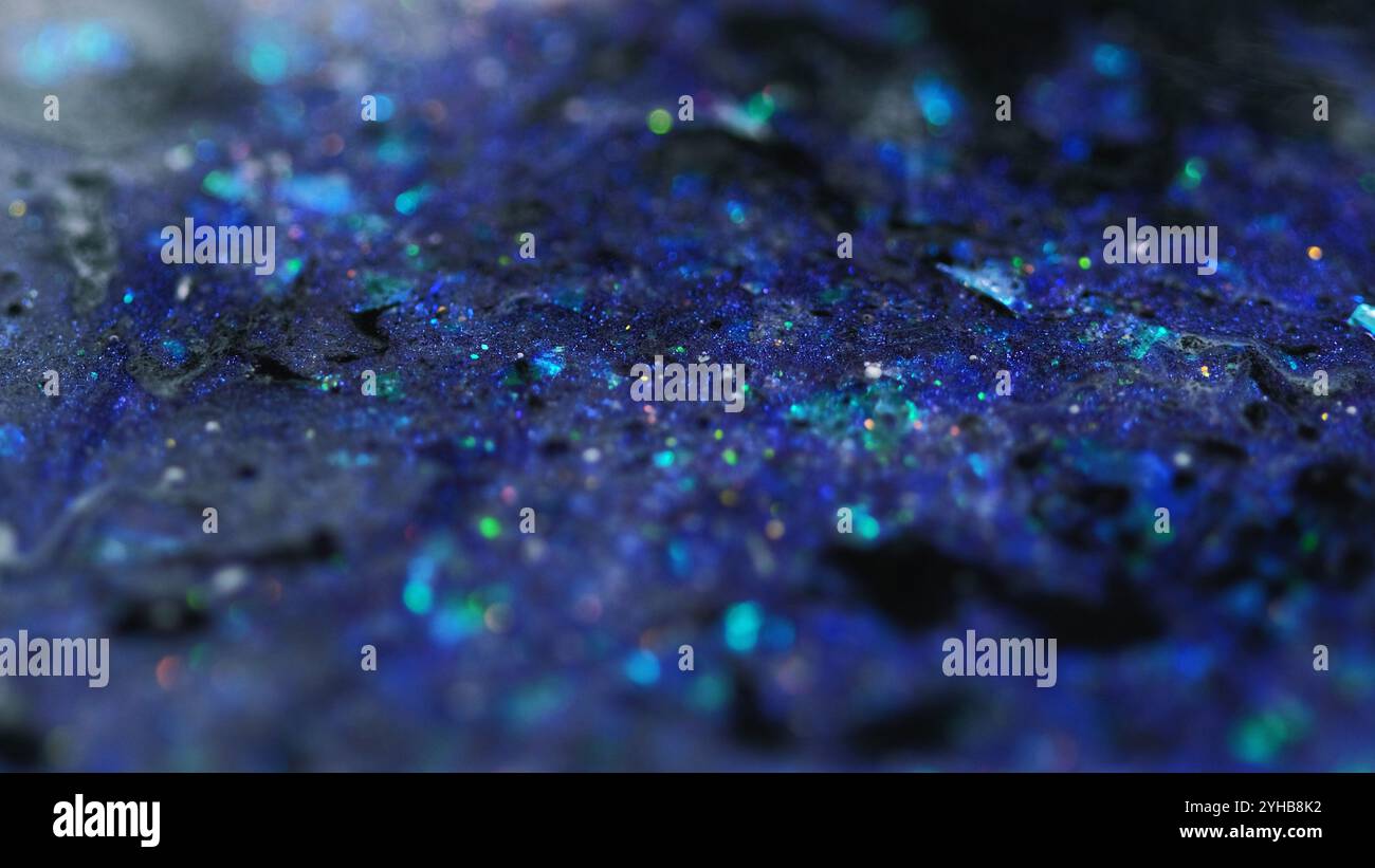 Liquid glitter spill. Shimmering fluid. Defocused purple black color ...