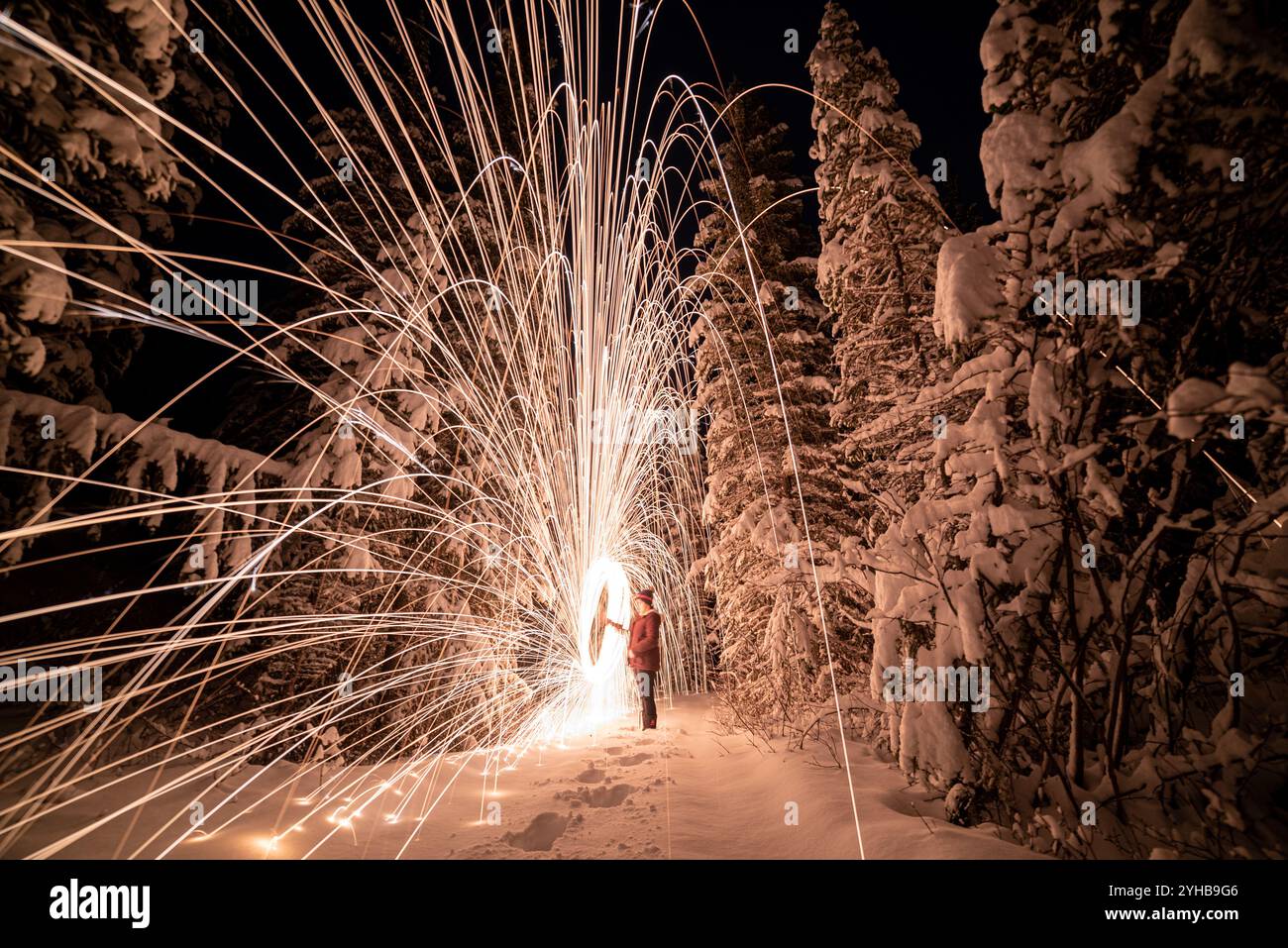 A winter snowy landscape with amazing sparking, steel wool effect ...