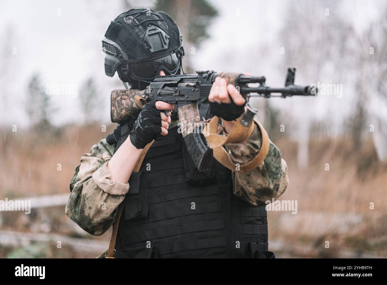 A special forces soldier storms a destroyed building. The concept of ...