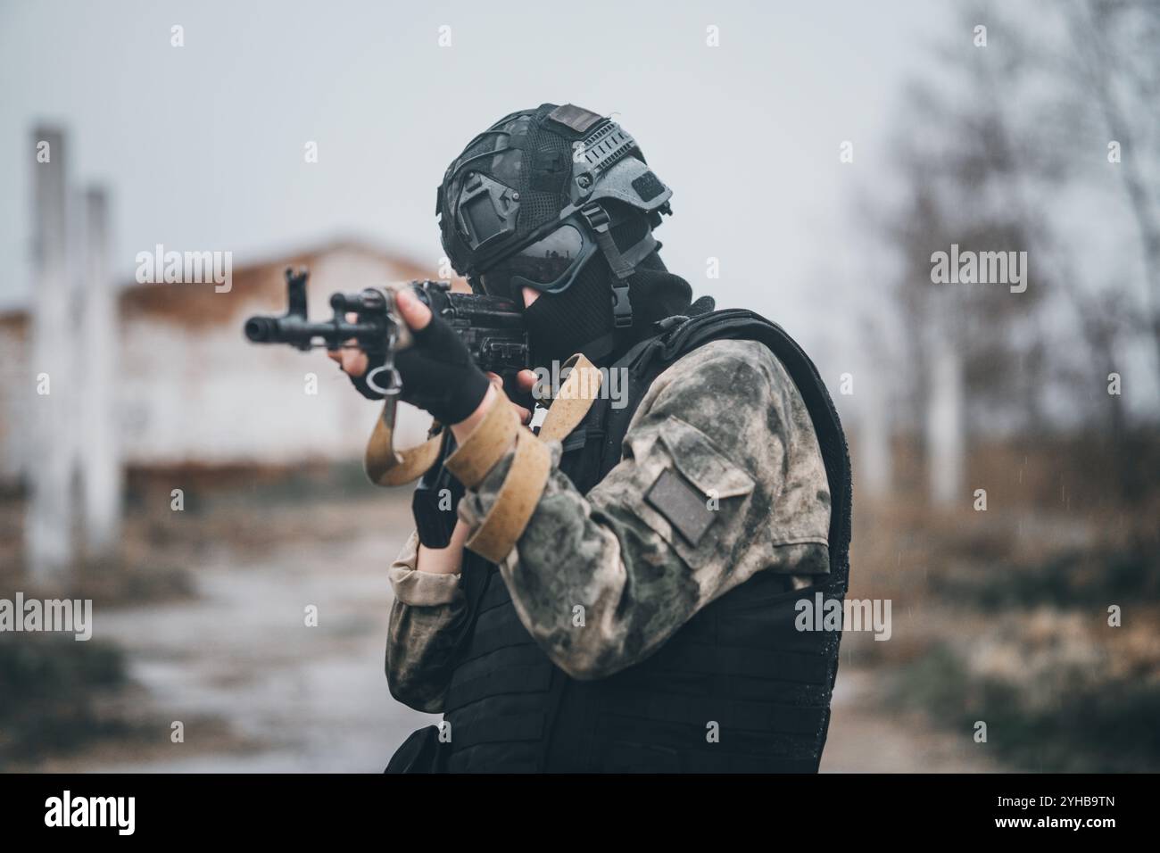 A special forces soldier storms a destroyed building. The concept of ...