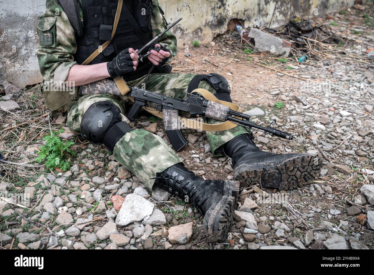 A special forces soldier reloads an assault rifle. Preparing for battle ...