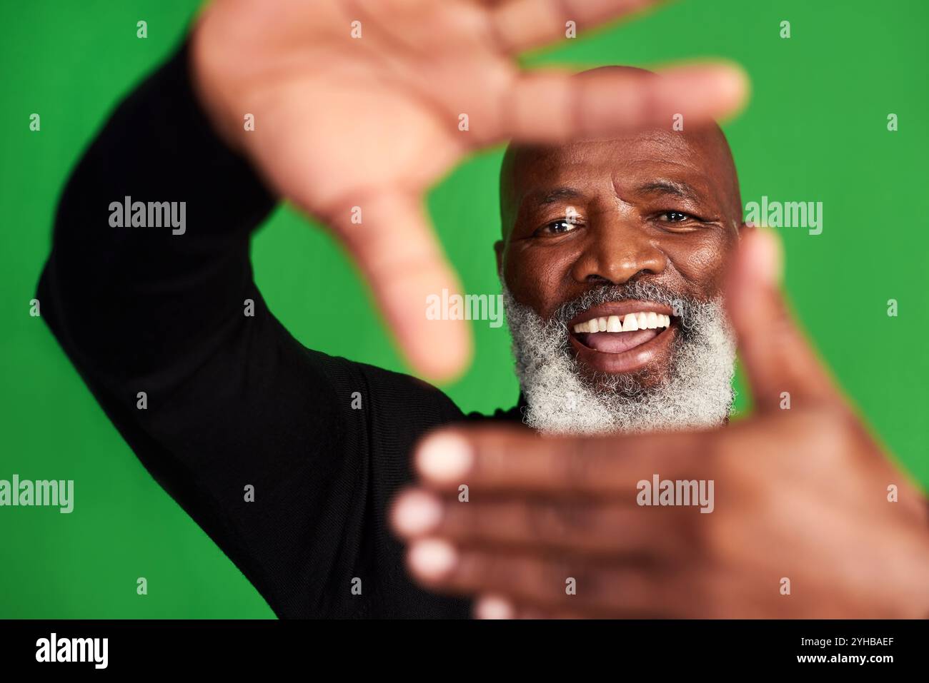 Green screen, portrait and black man green with finger frame, smile and ...