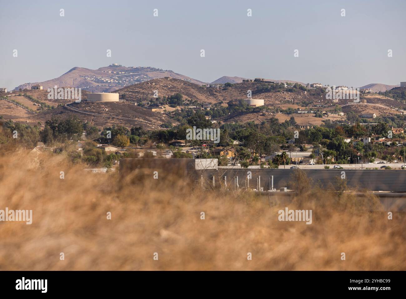 Afternoon winter sun shines on mountains and downtown Norco, California ...