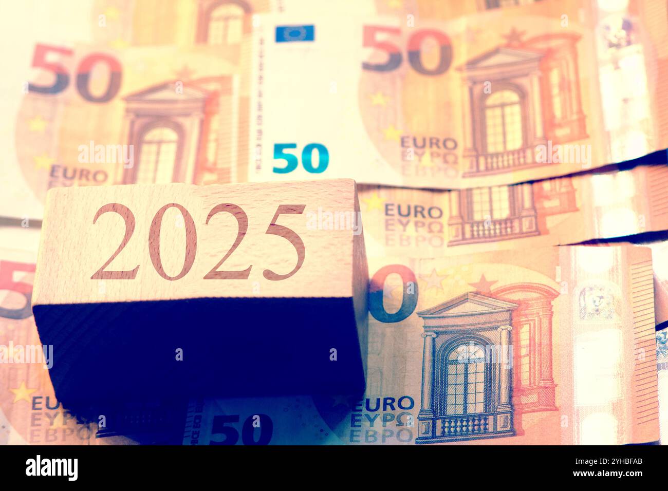 New Year 2025 on Wood Block with euro banknotes Stock Photo - Alamy