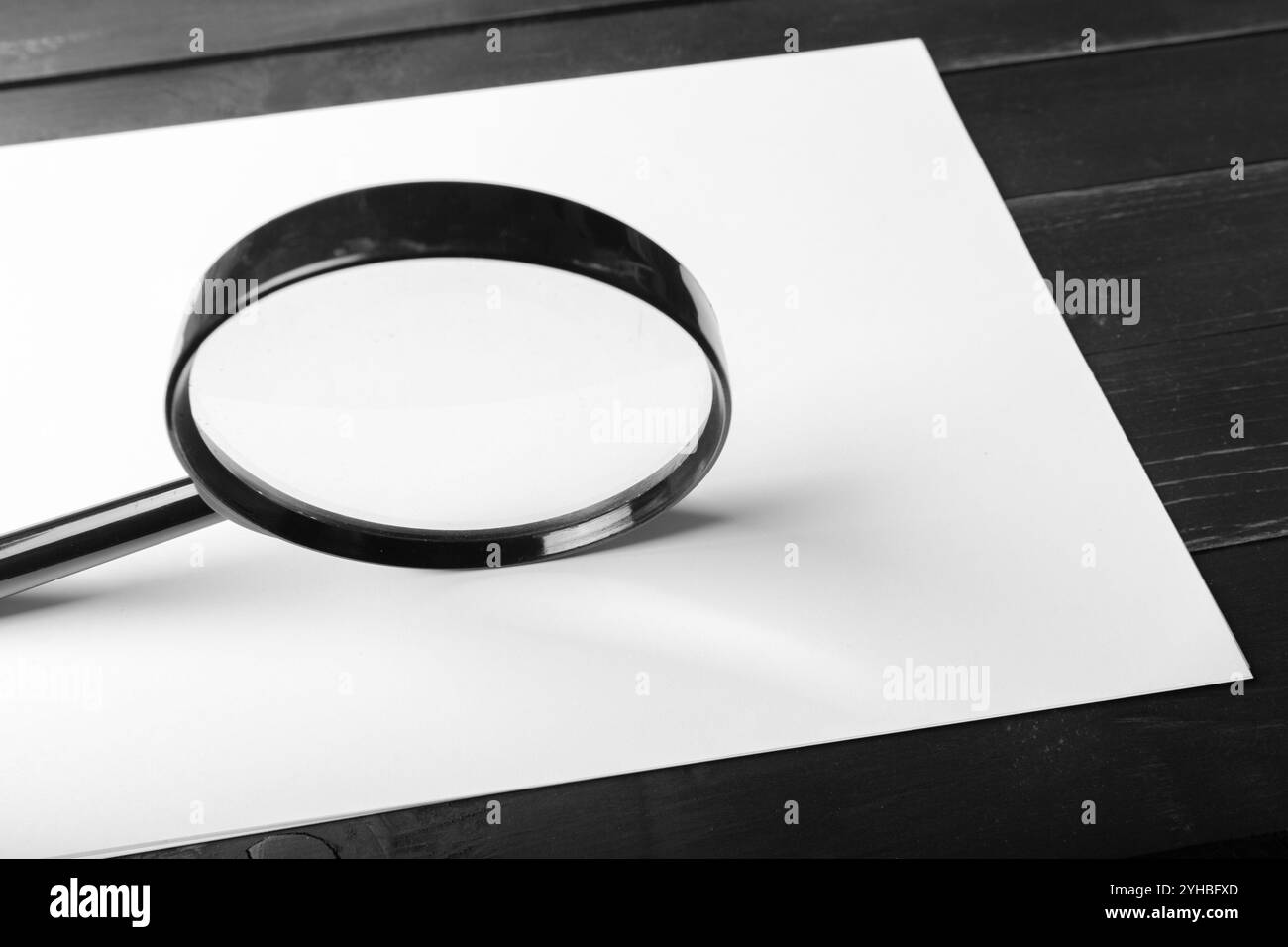 Magnifying glass wooden table Black and White Stock Photos & Images - Alamy