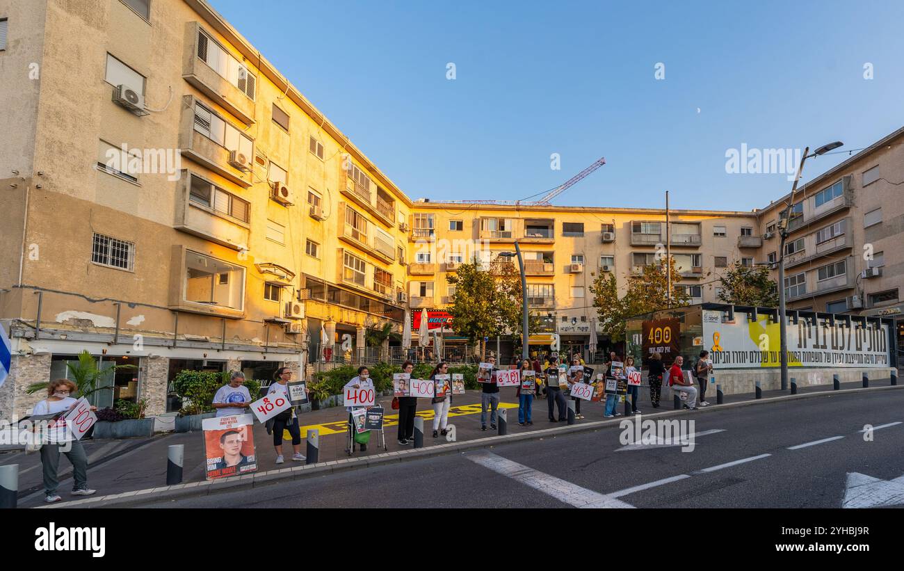 Haifa, Israel - November 09, 2024: People stand with hostage posters ...